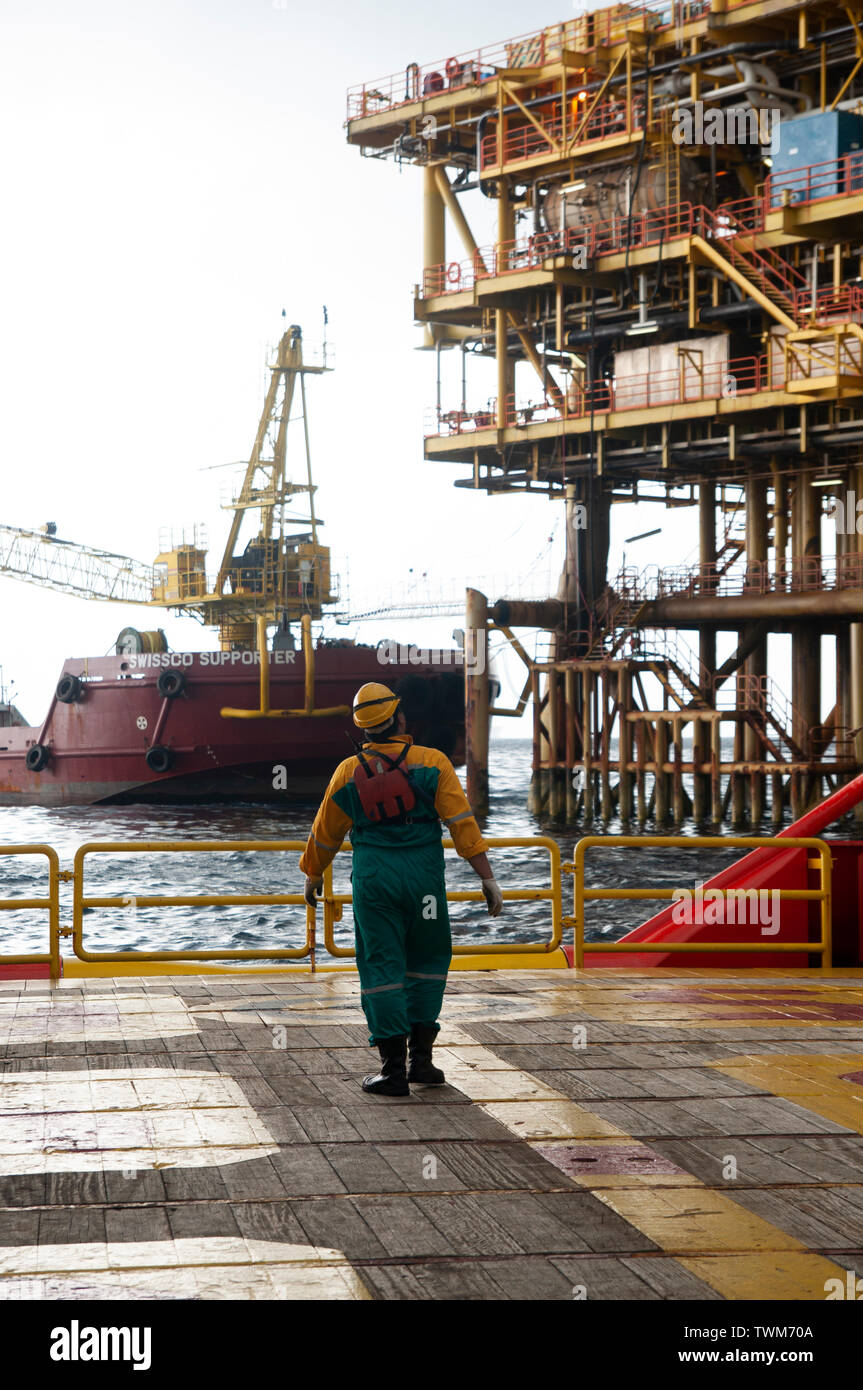 offshore worker working on deck for loading cargo Stock Photo - Alamy