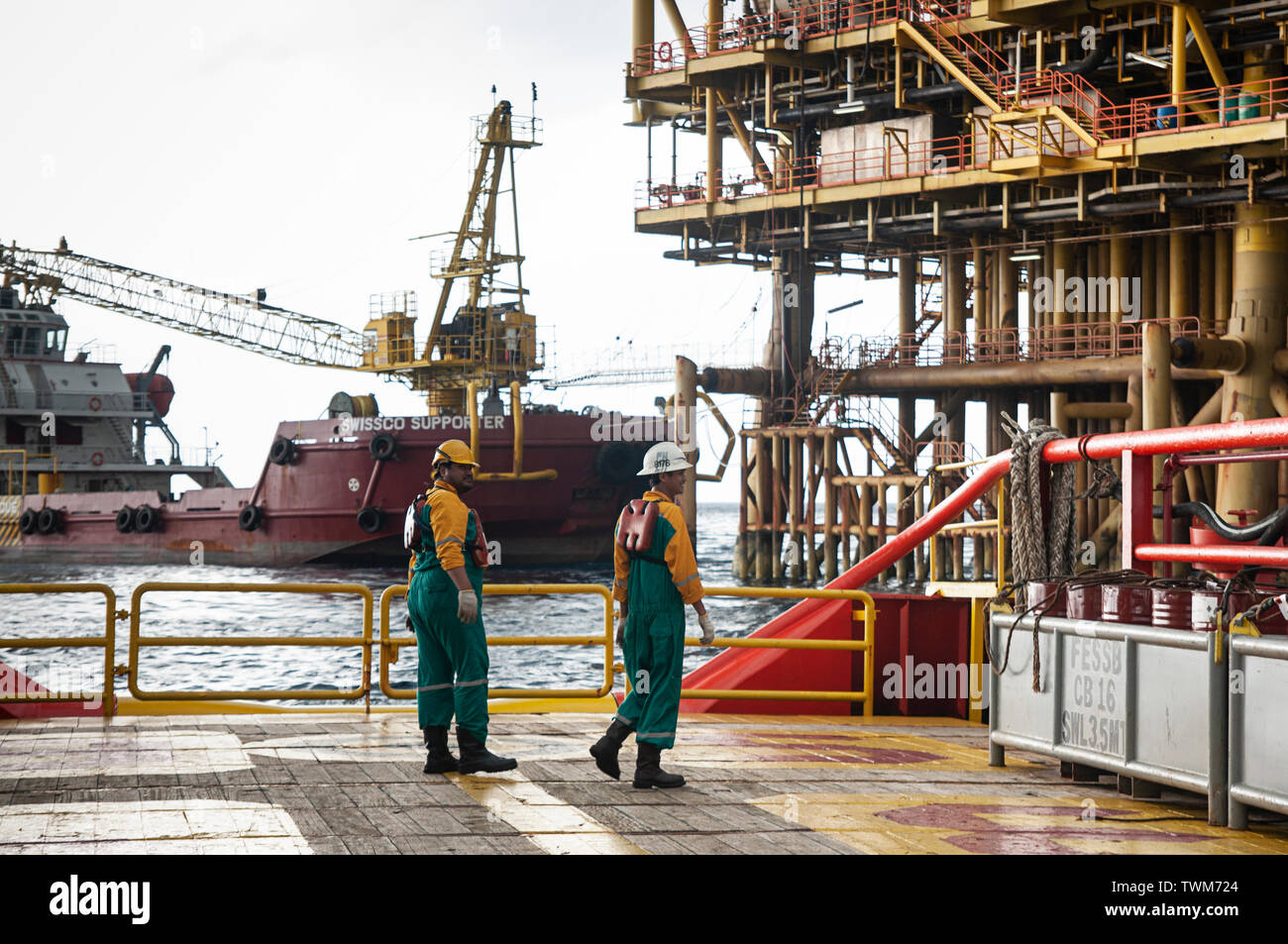 offshore worker working on deck for loading cargo Stock Photo - Alamy