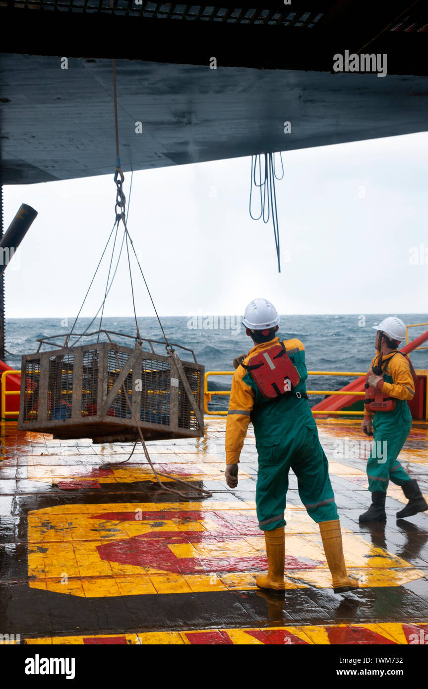 offshore worker working on deck for loading cargo Stock Photo - Alamy