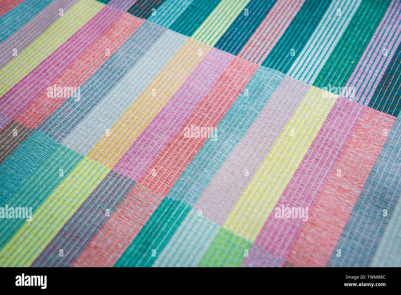 Colorful textile abstract background in a full frame close-up of angled ...