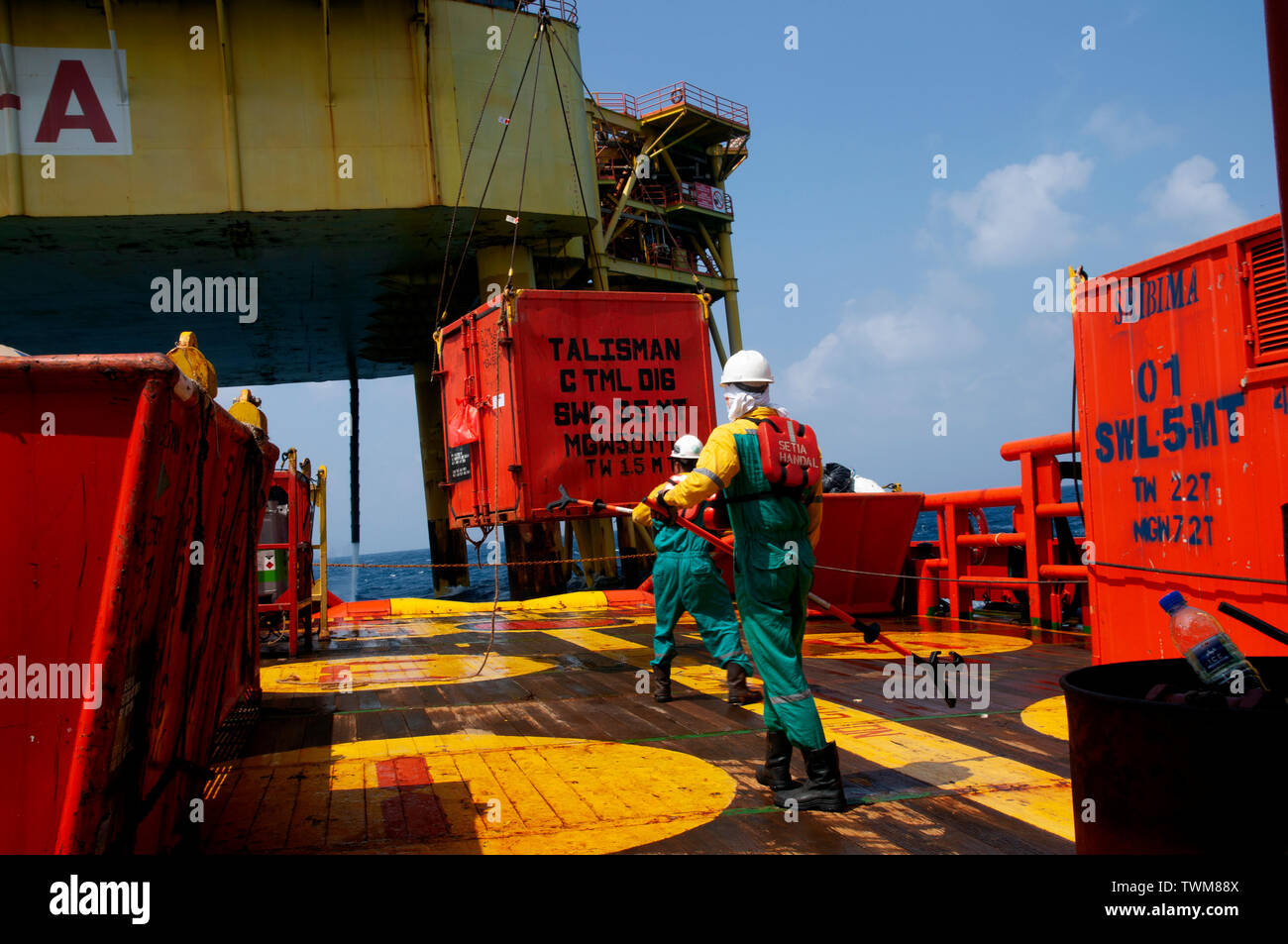 marine crew handling and arrange cargo on deck by using special tool ...