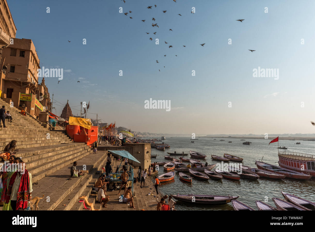 Varanasi Ghat on a winter soft sunny morning with boats and the ...