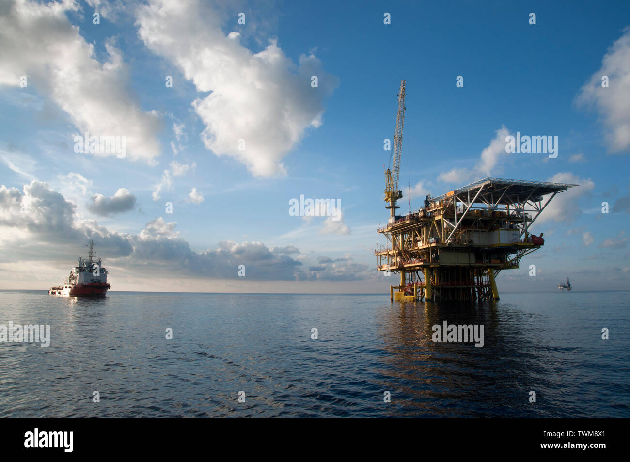 oil platform during morning with offshore vessel Stock Photo - Alamy
