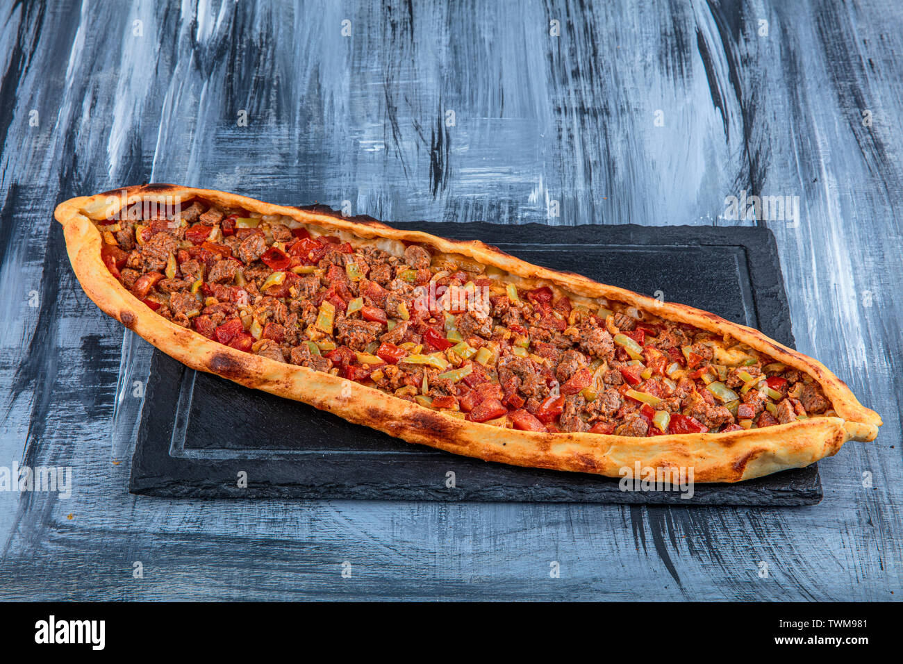 Traditional Turkish Cuisine; pide with cubed meat / kusbasili pide ...