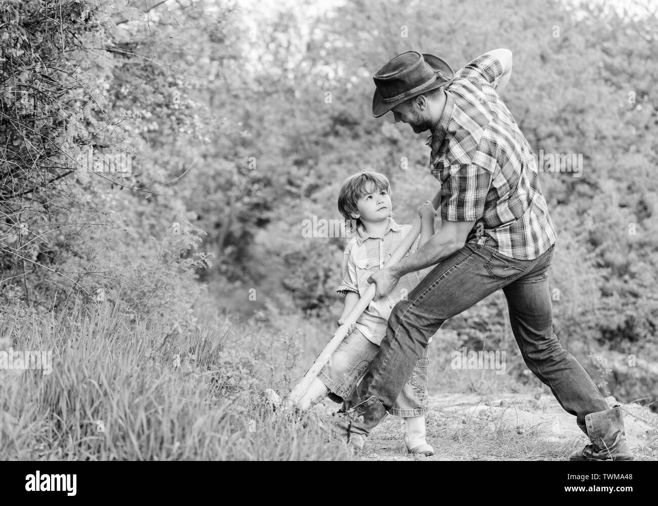 Little boy and father with shovel looking for treasures. Happy ...
