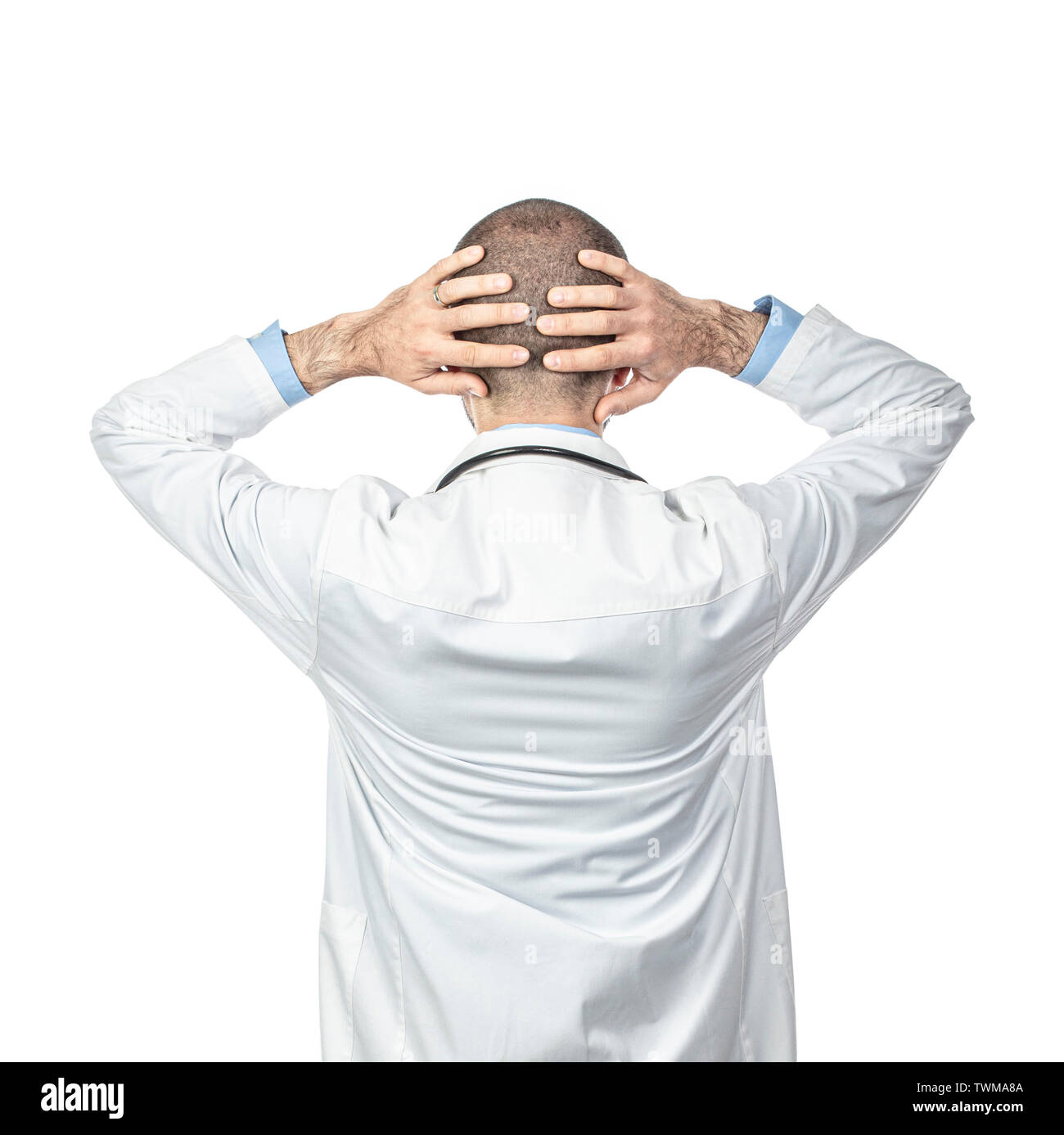 doctor seen from behind with his hands resting on his head. isolated on ...