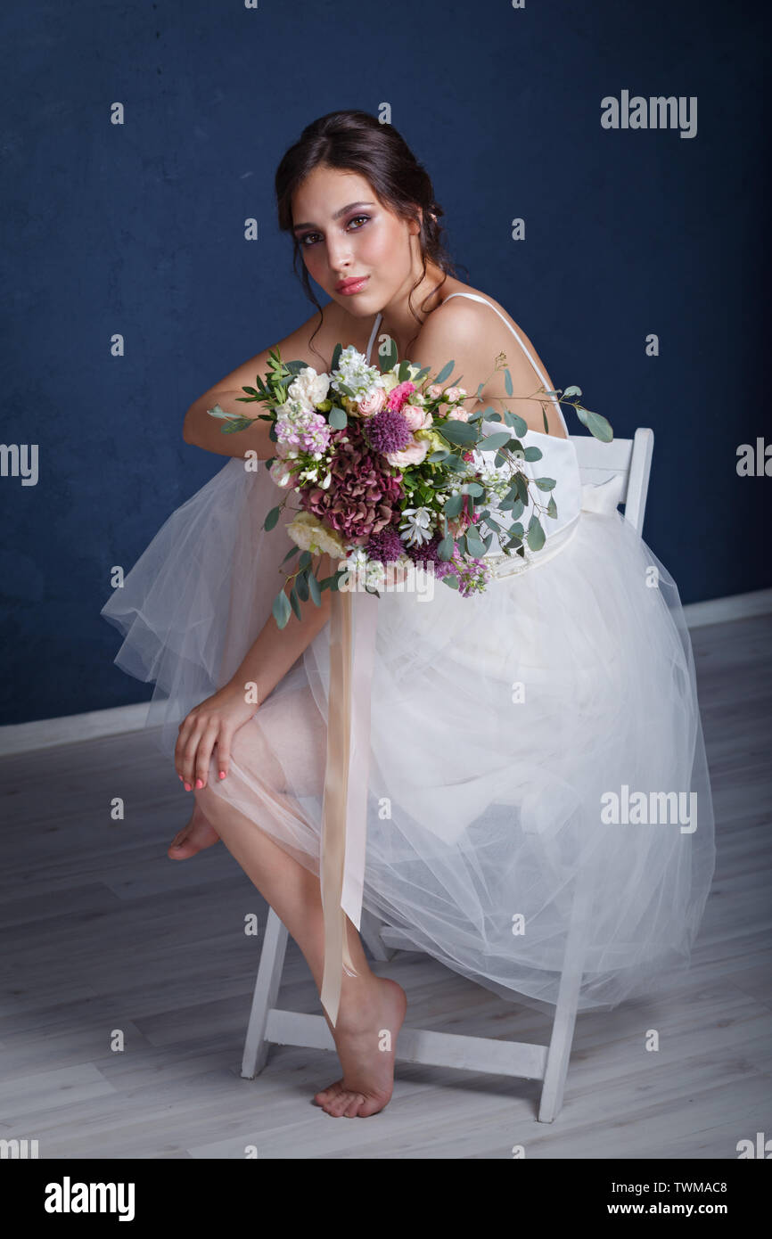 Attractive barefoot brunette lady sitting hi-res stock photography and ...