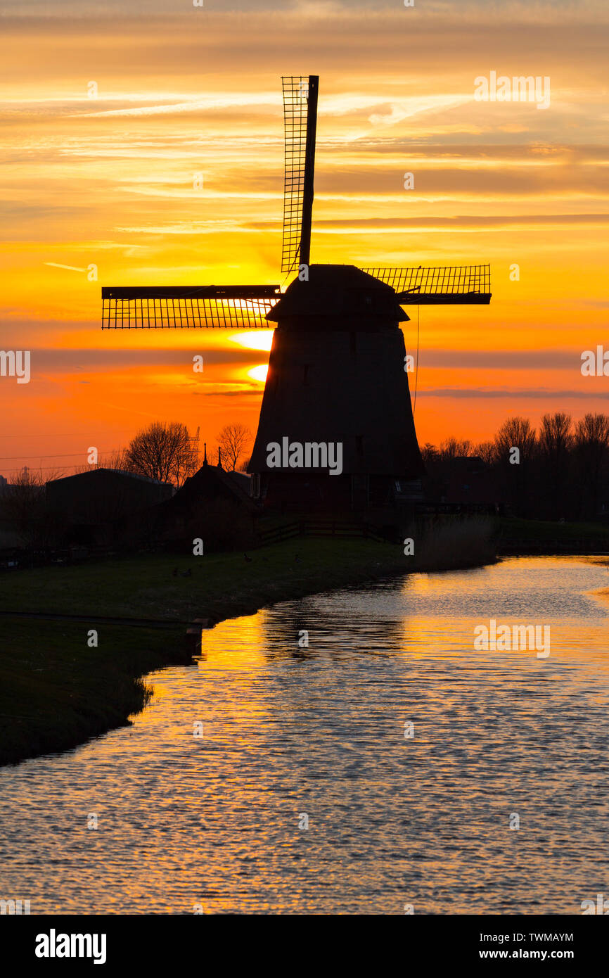 Windmills at Schermerhorn showing sea level, Stompetoren, Netherlands ...