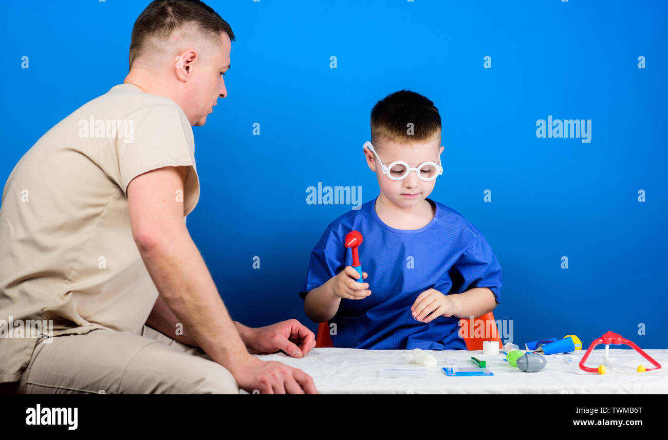 Medical examination. Boy cute child and his father doctor. Hospital ...