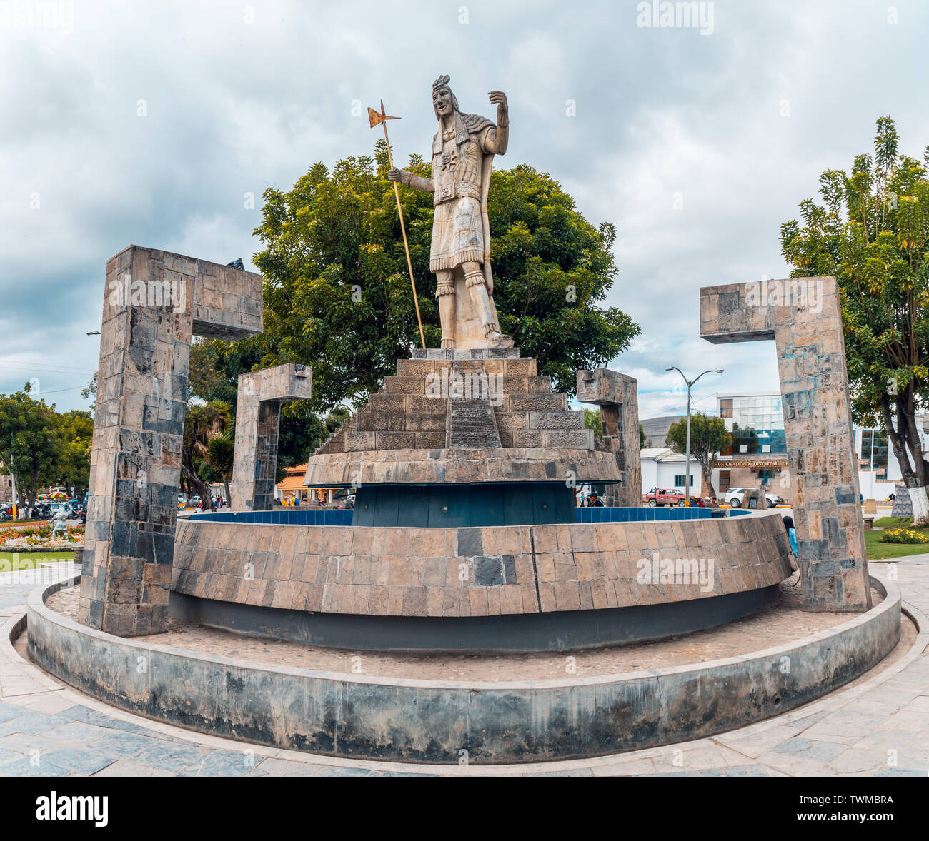 Pool with sculpture of the Inca in Plaza de armas of Baños del Inca in ...