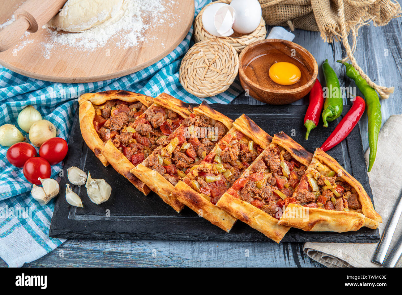 Traditional Turkish Cuisine; pide with cubed meat / kusbasili pide ...