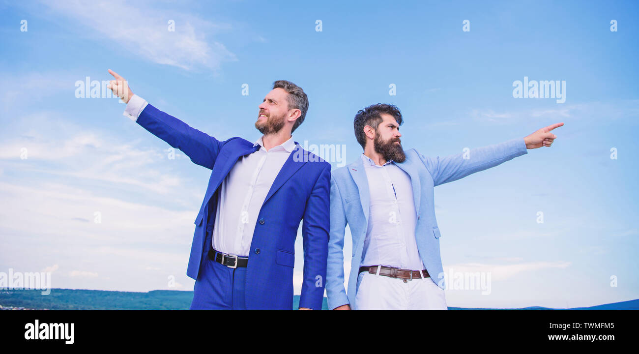 Changing course. Men formal suit managers pointing at opposite ...