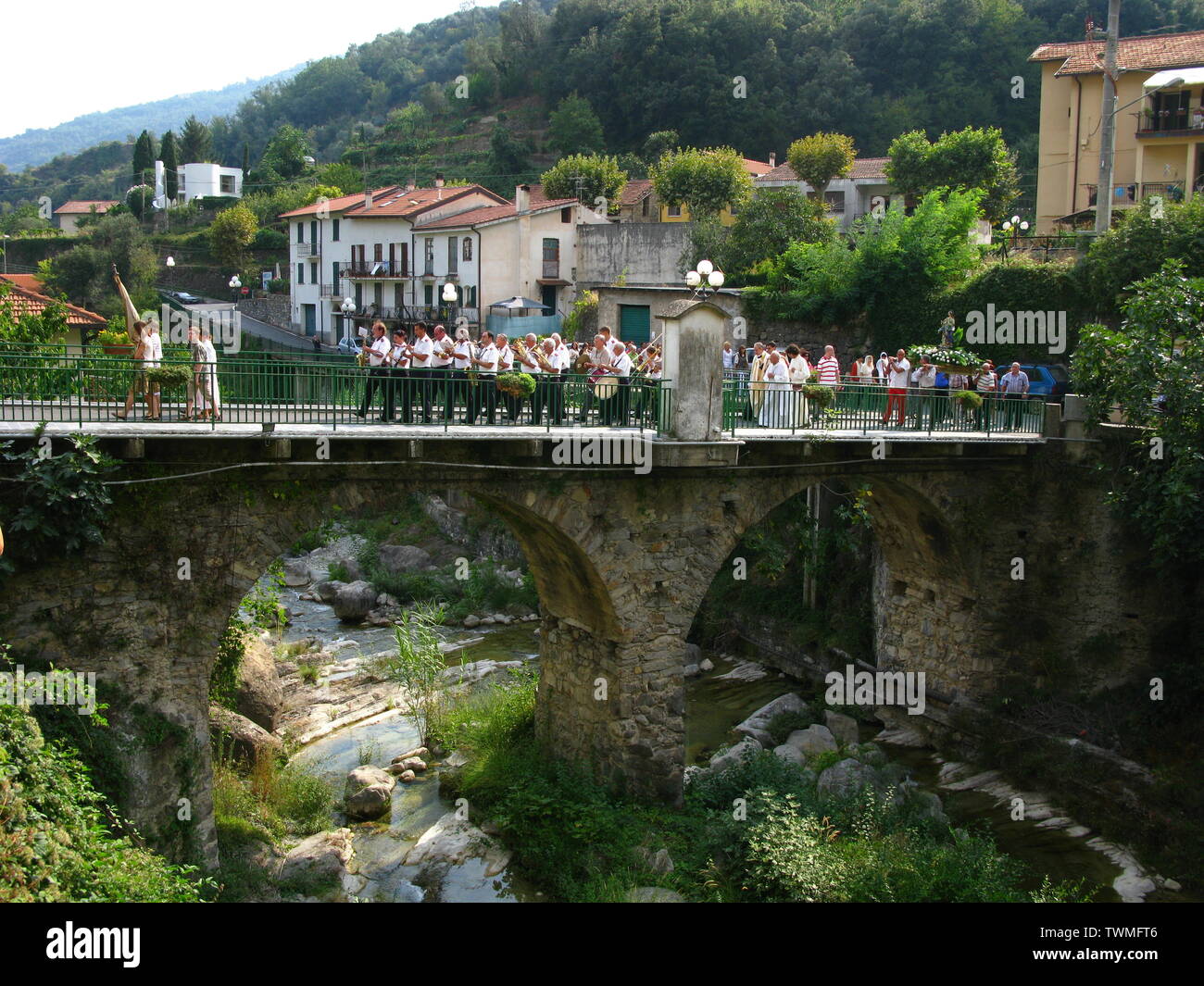 Religious procession crosses bridge in old Italian town Stock Photo - Alamy