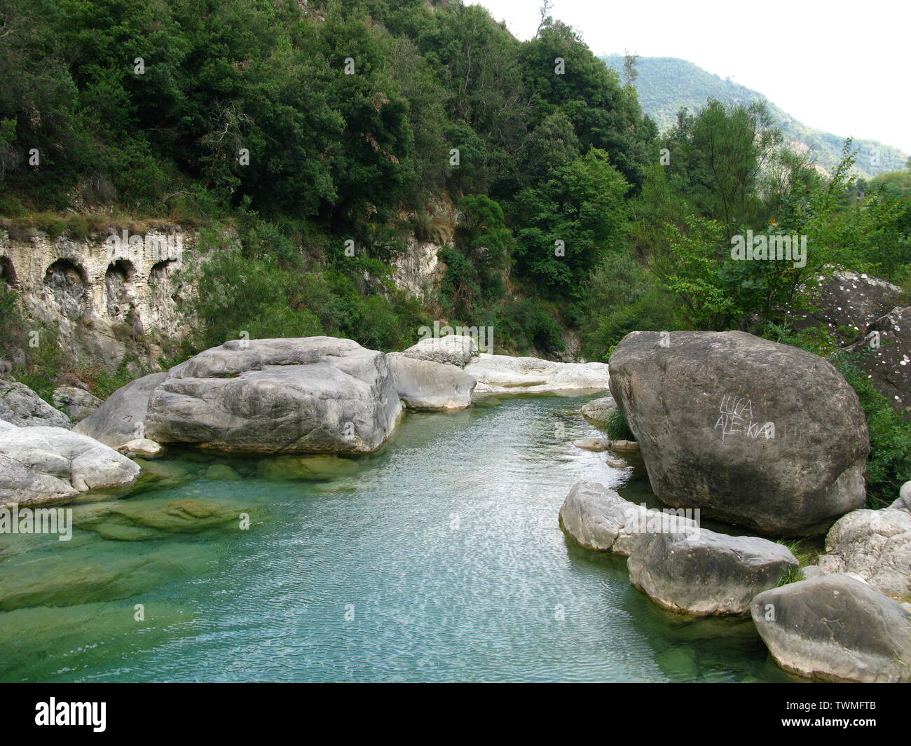 Blue river pool with ancient aqueduct behind Stock Photo - Alamy
