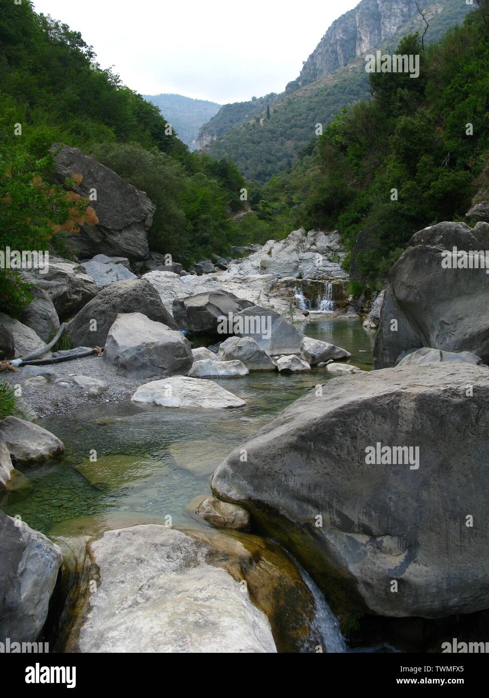 Blue river pool with ancient aqueduct behind Stock Photo - Alamy