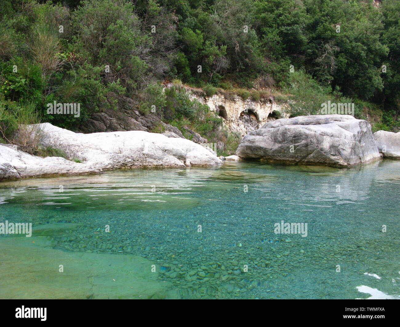 Blue river pool with ancient aqueduct behind Stock Photo - Alamy