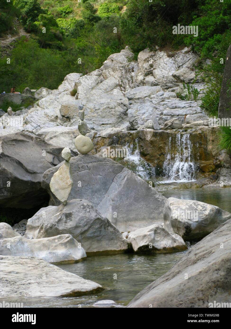 Rock sculptures set in a river Stock Photo - Alamy