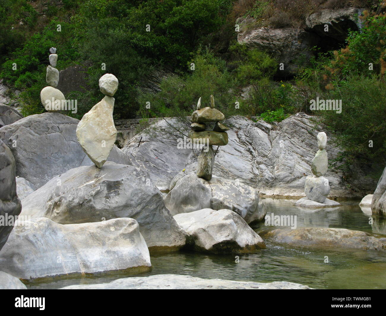 Rock sculptures set in a river Stock Photo - Alamy
