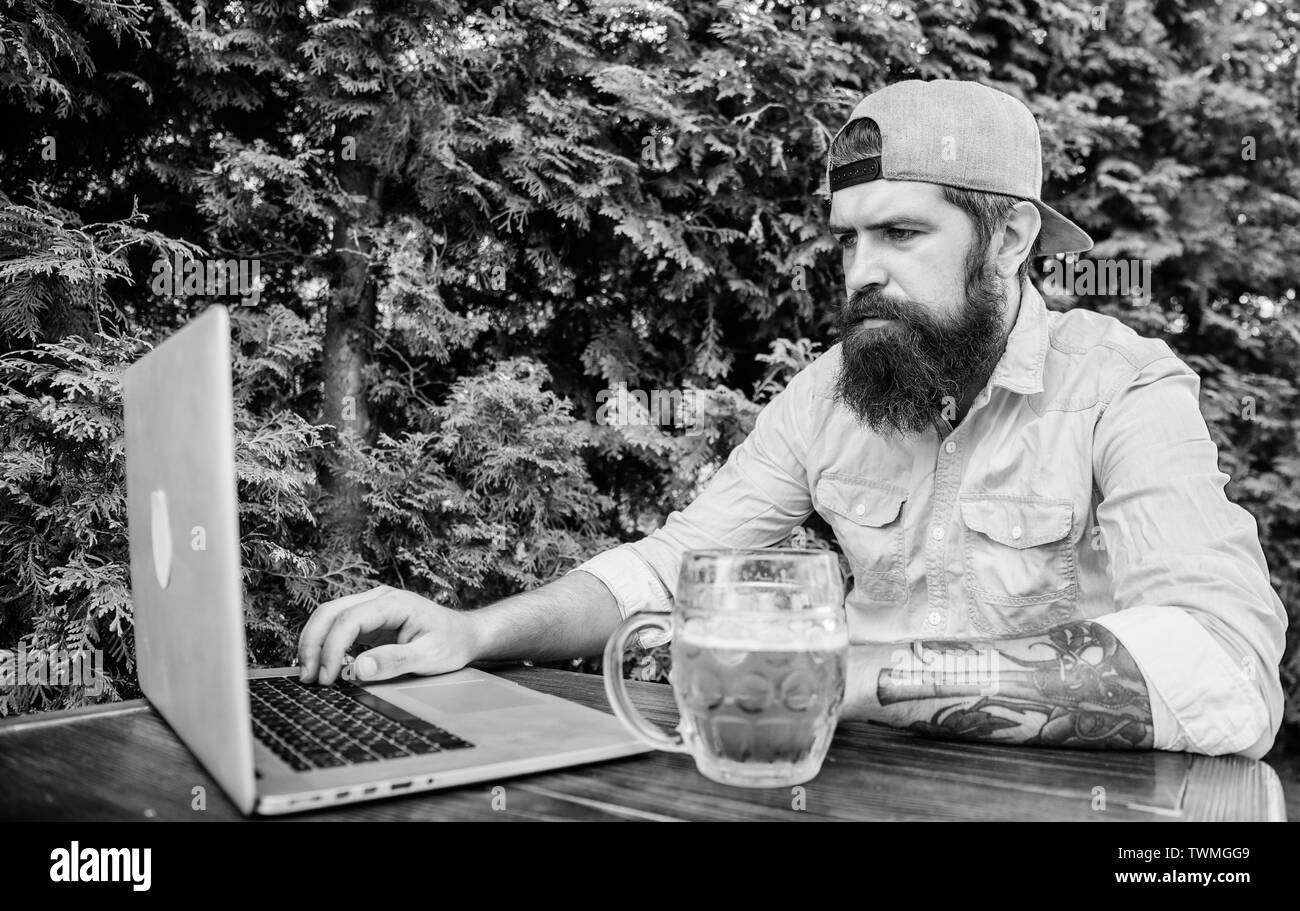 Taking the online world and beer mug with him. Computer keyboard ...