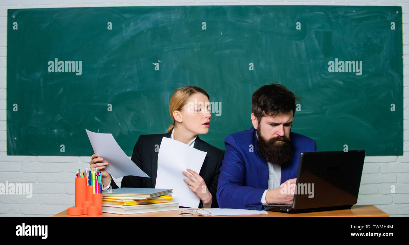 Annual report. Teacher and supervisor working together in school ...