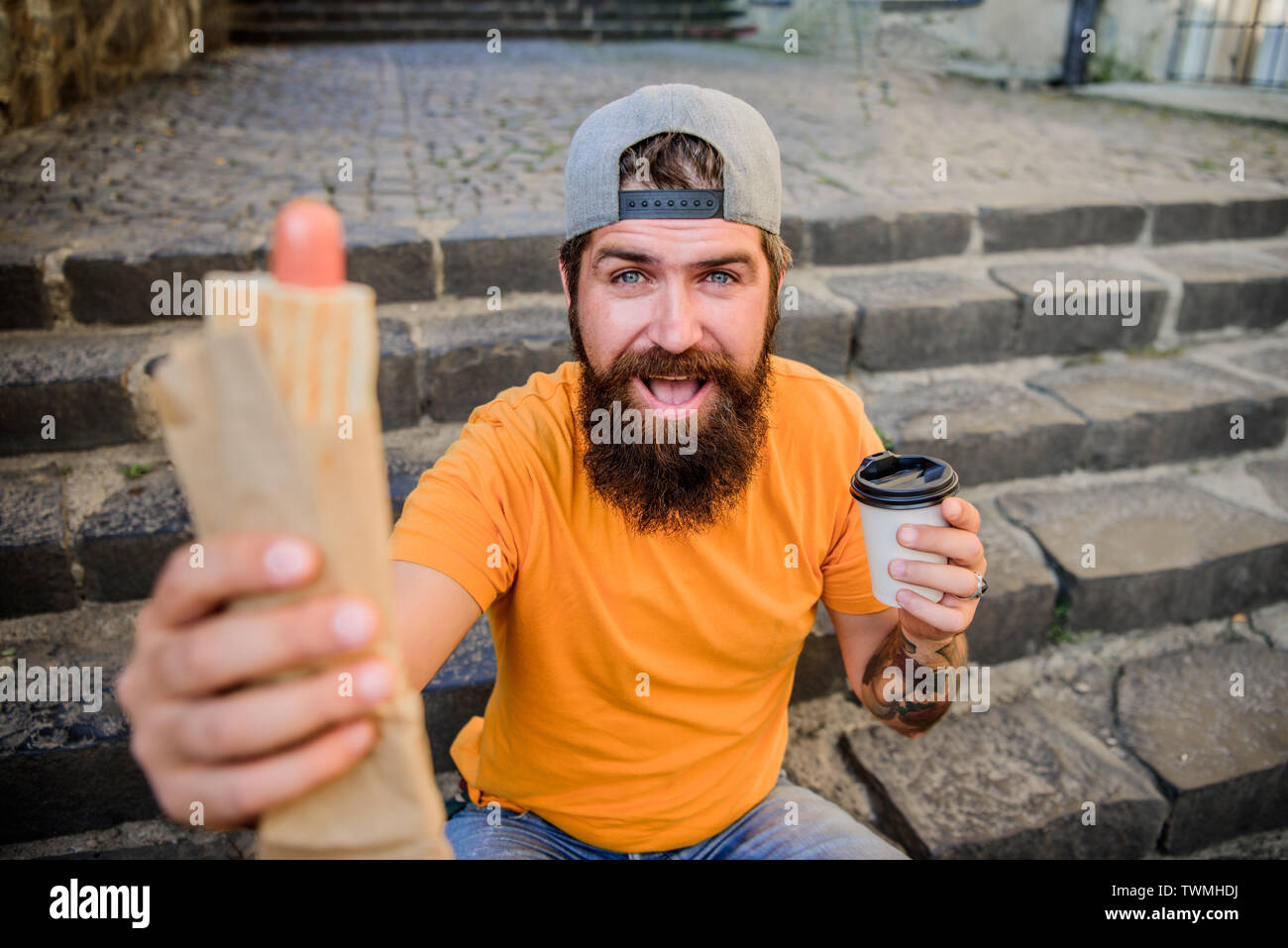 Meal that tastes right. Bearded man eating unhealthy food during rest ...