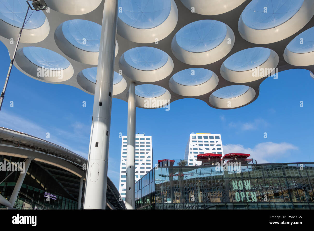 Modern roof with circle glass windows over passage shopping center ...