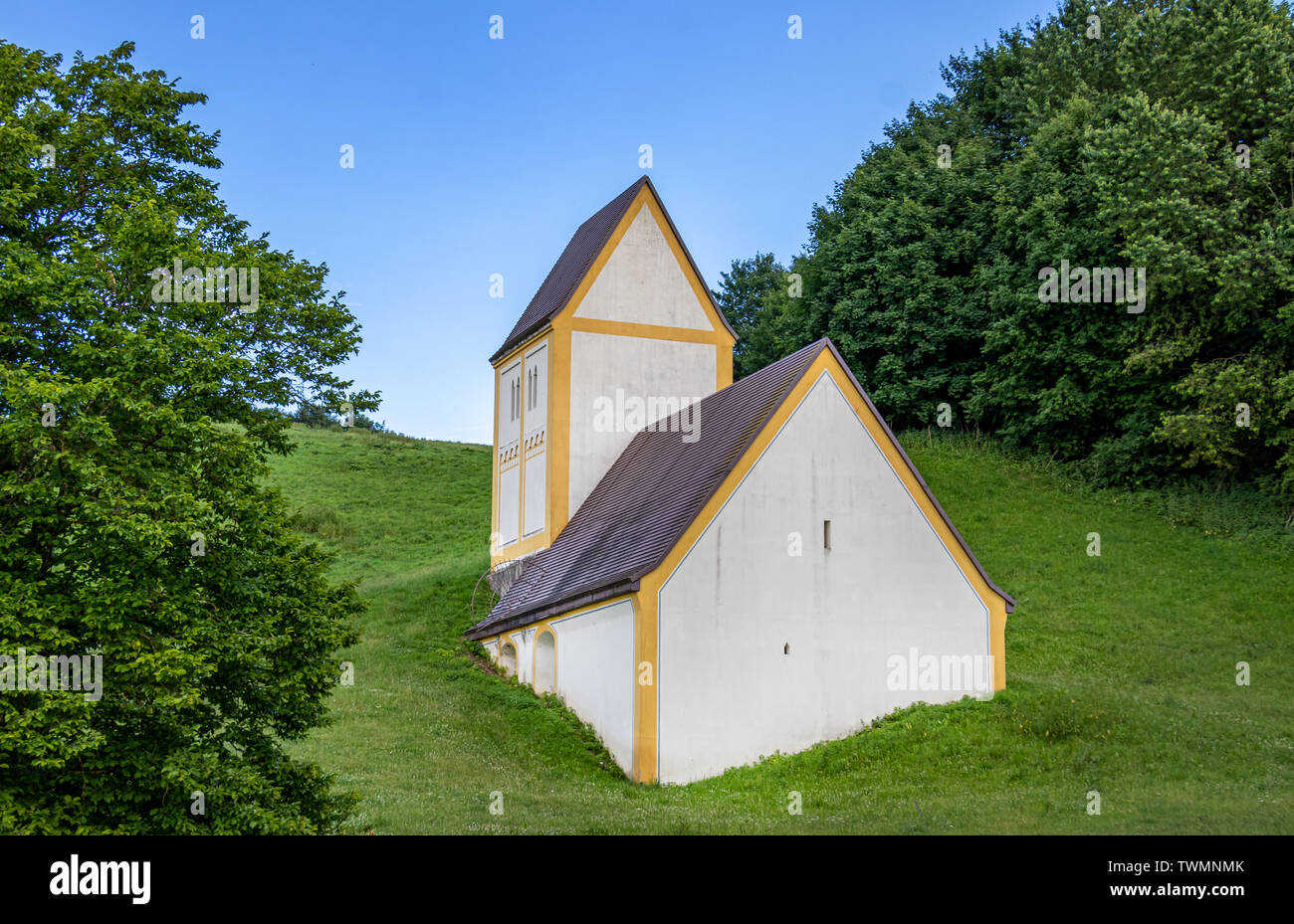 ingrown church in meadow mountain, munich Stock Photo - Alamy