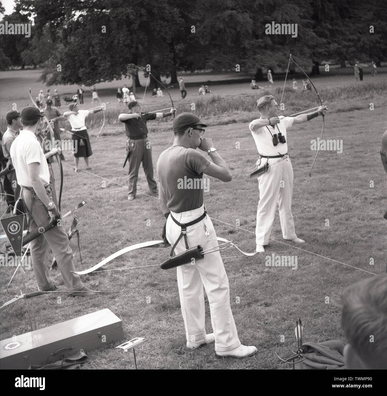 1960s, historical, archery competition, male and female archers on a ...