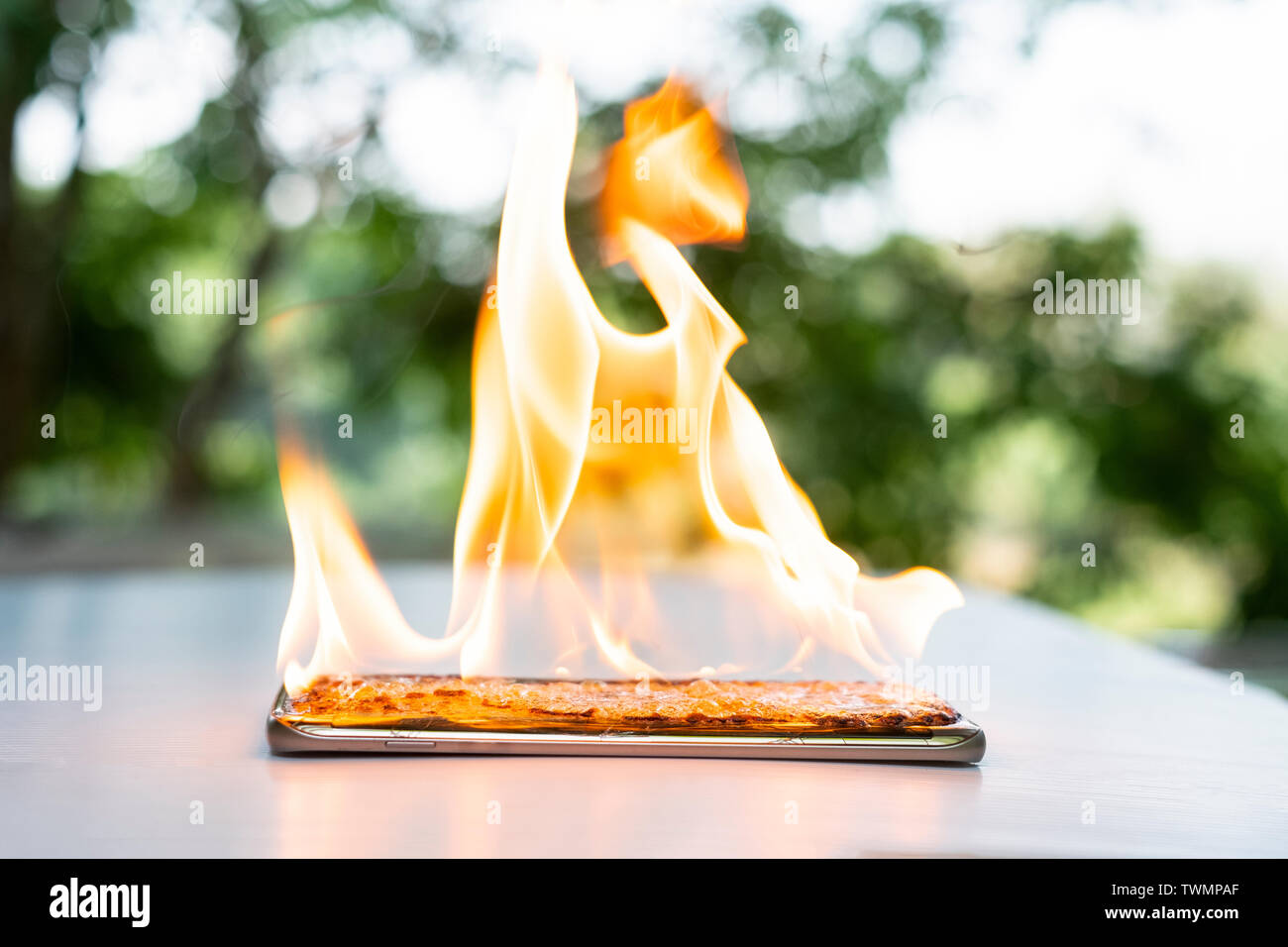 mobile on fire Stock Photo - Alamy