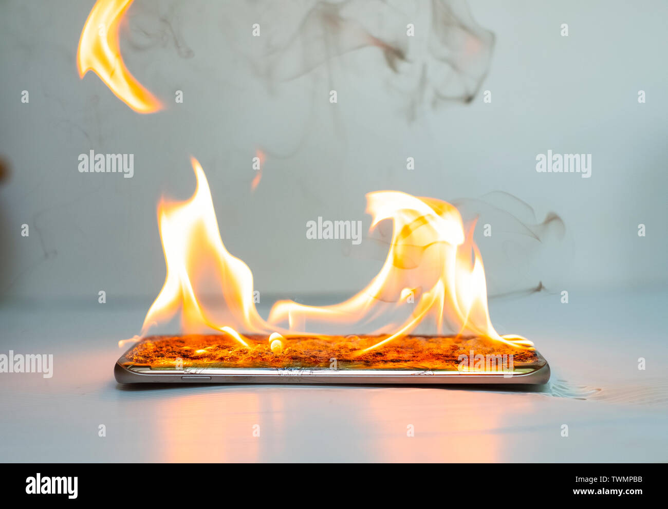 mobile on fire Stock Photo - Alamy