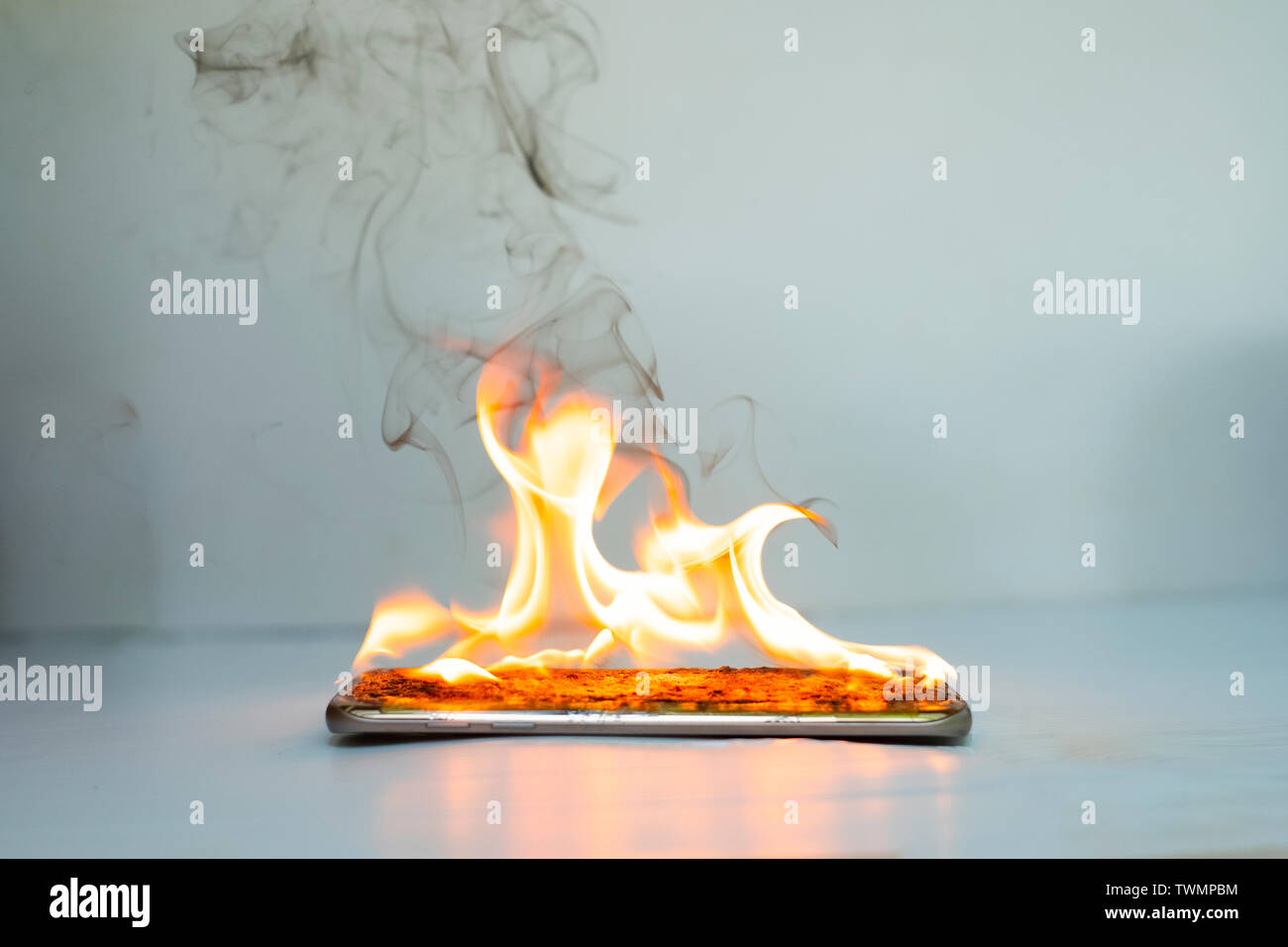 mobile on fire Stock Photo - Alamy