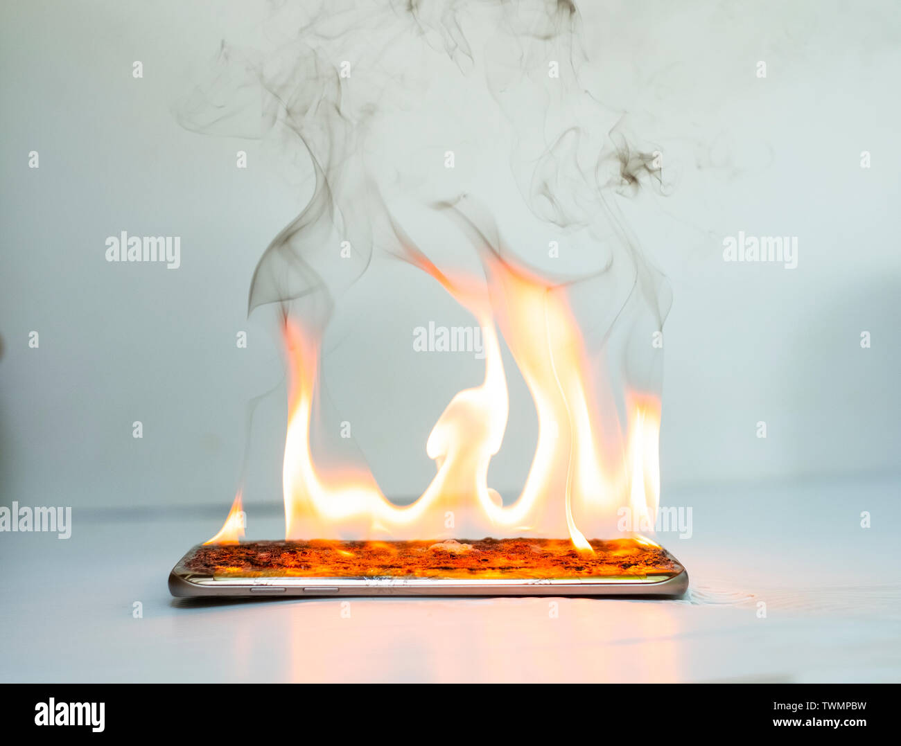 mobile on fire Stock Photo - Alamy