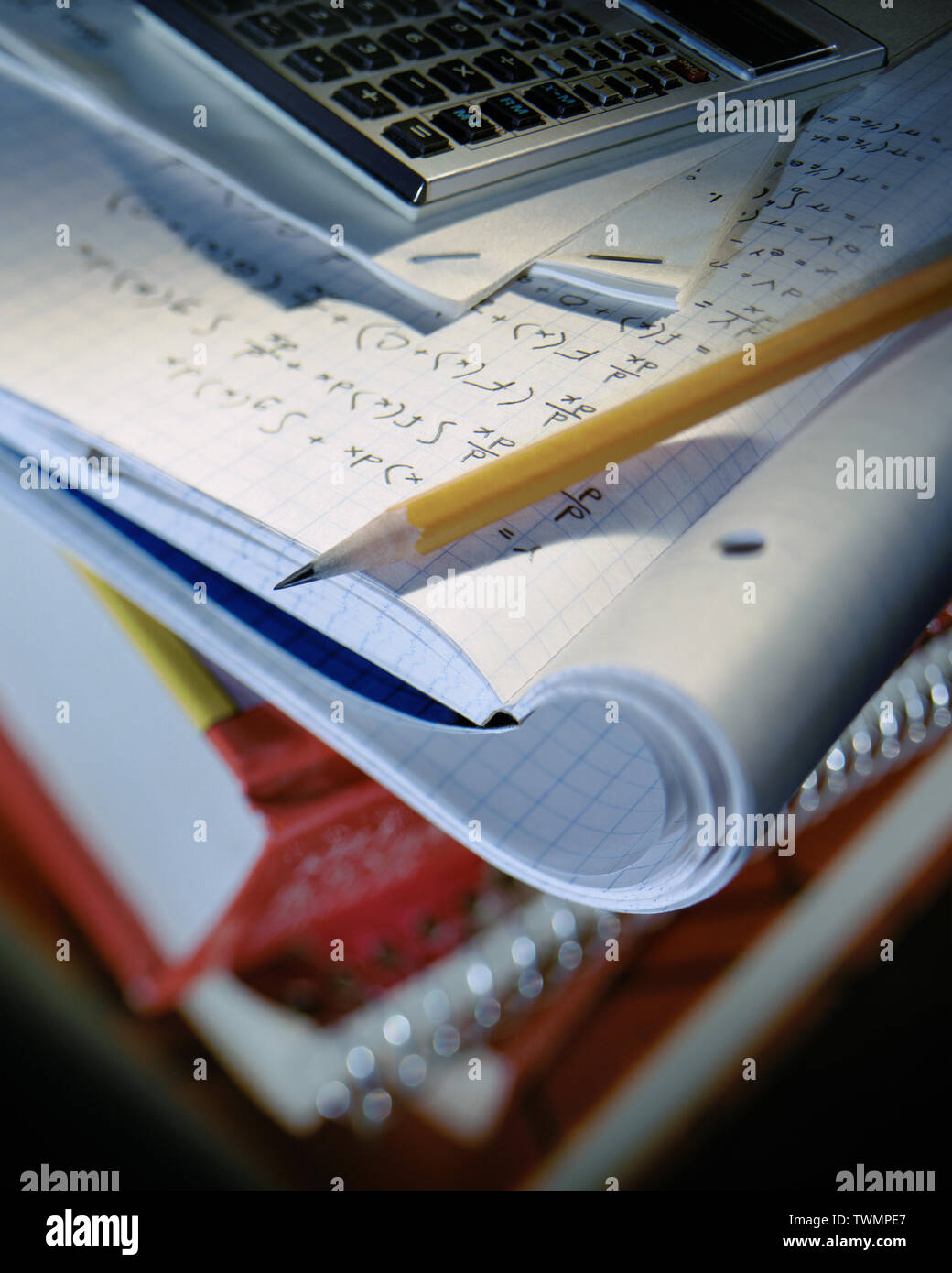 Selective focus image of school homework with notebook open to hand ...