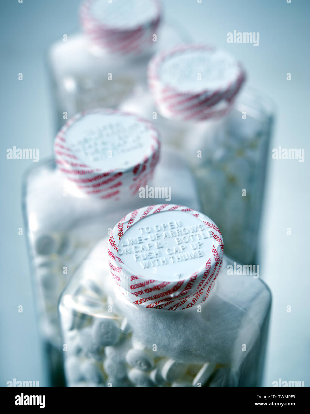 Selective focus image of safety sealed bottles of aspirin pills ...