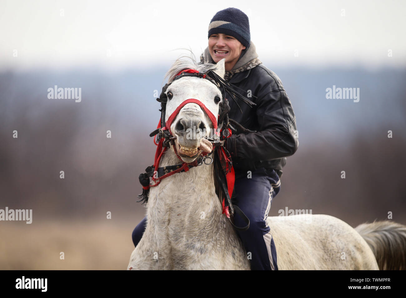 Pietrosani, Romania - January 6, 2019: Man is bareback riding an ...