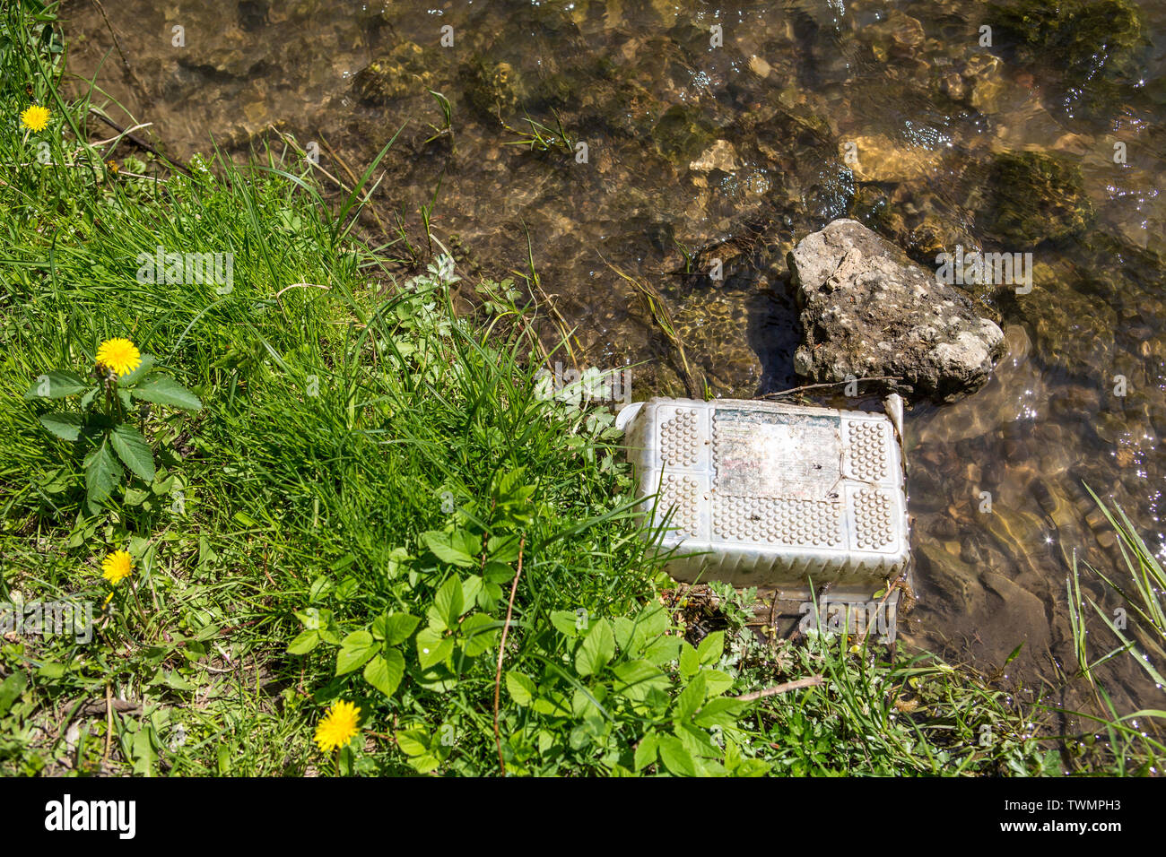 Plastic packaging dumped in nature Stock Photo - Alamy