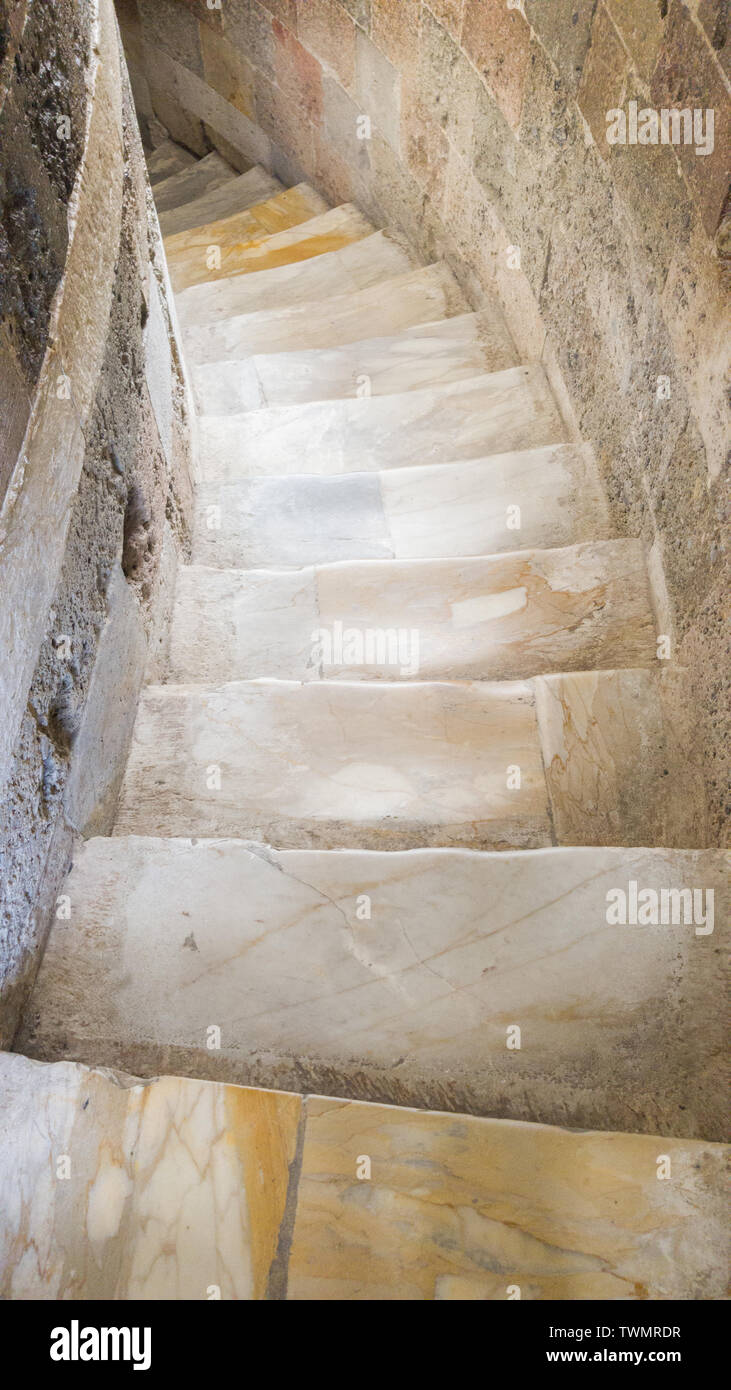 A narrow stone corridor with a staircase in the tower Stock Photo - Alamy