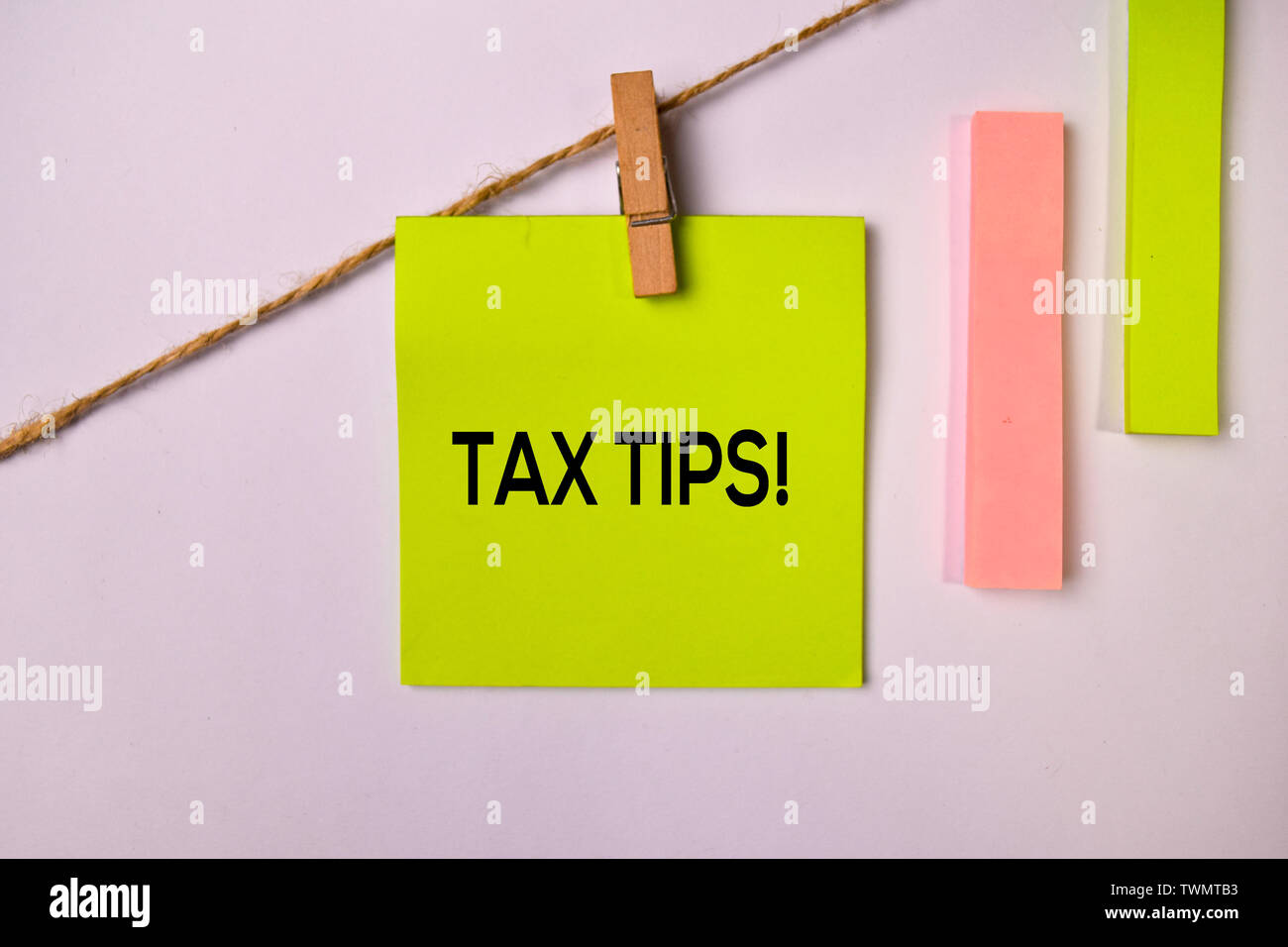 Tax Tips! on sticky notes isolated on white background Stock Photo - Alamy
