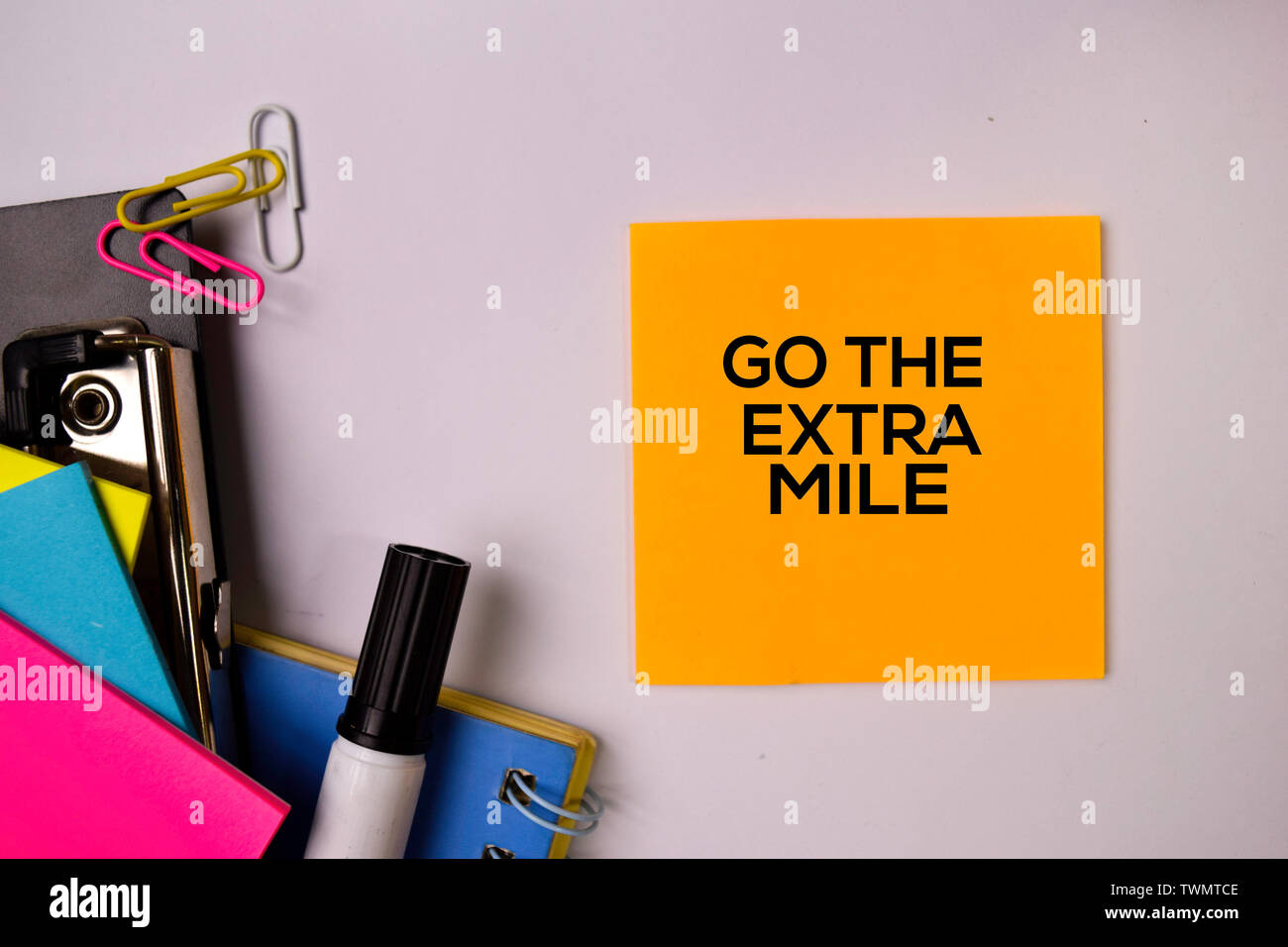 Go The Extra Mile on sticky notes isolated on white background Stock ...
