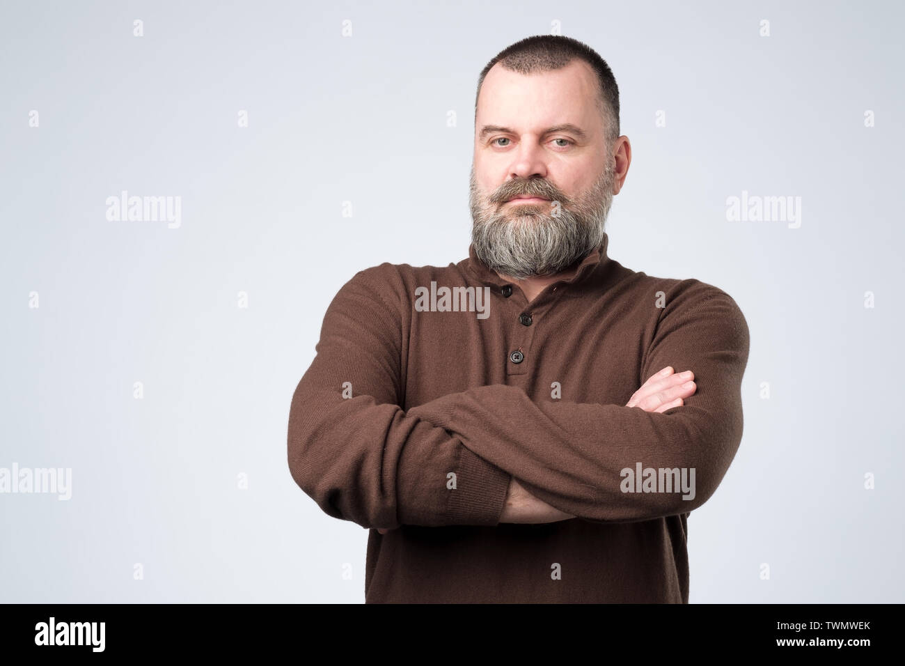 Serious mature european man standing with arms folded Stock Photo - Alamy Serious mature european man standing with arms folded Stock Photo - Alamy