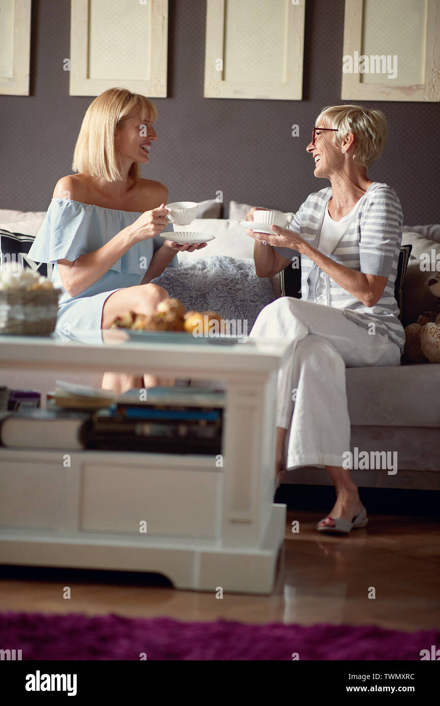 Young woman in visit to her mother Stock Photo - Alamy
