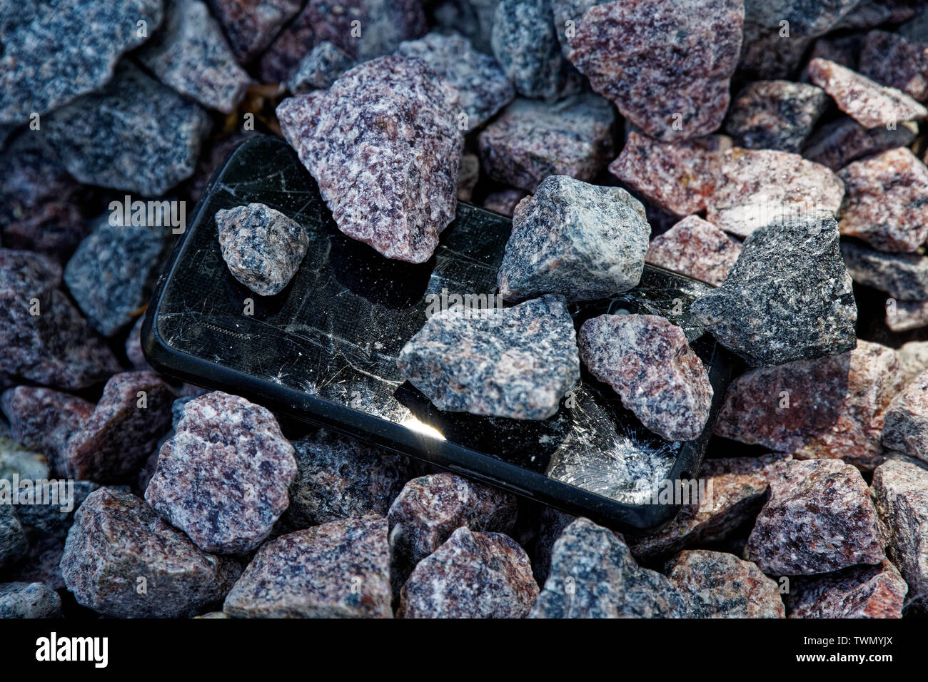 Cell phone with broken glass on gravel granite stones, unbreakable ...