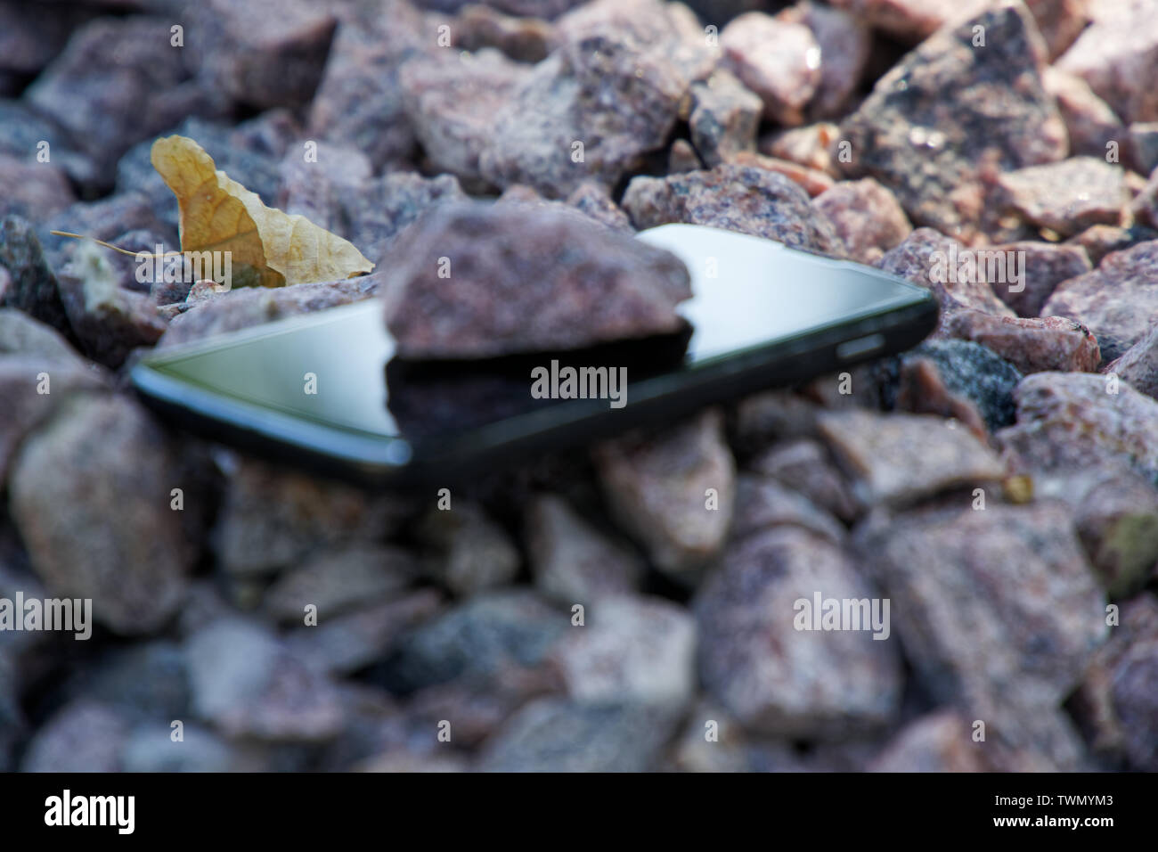 Cell phone with broken glass on gravel granite stones, unbreakable ...