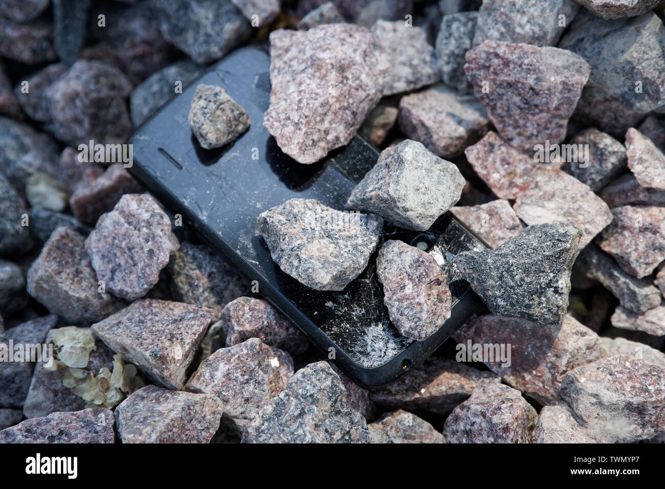 Cell phone with broken glass on gravel granite stones, unbreakable ...