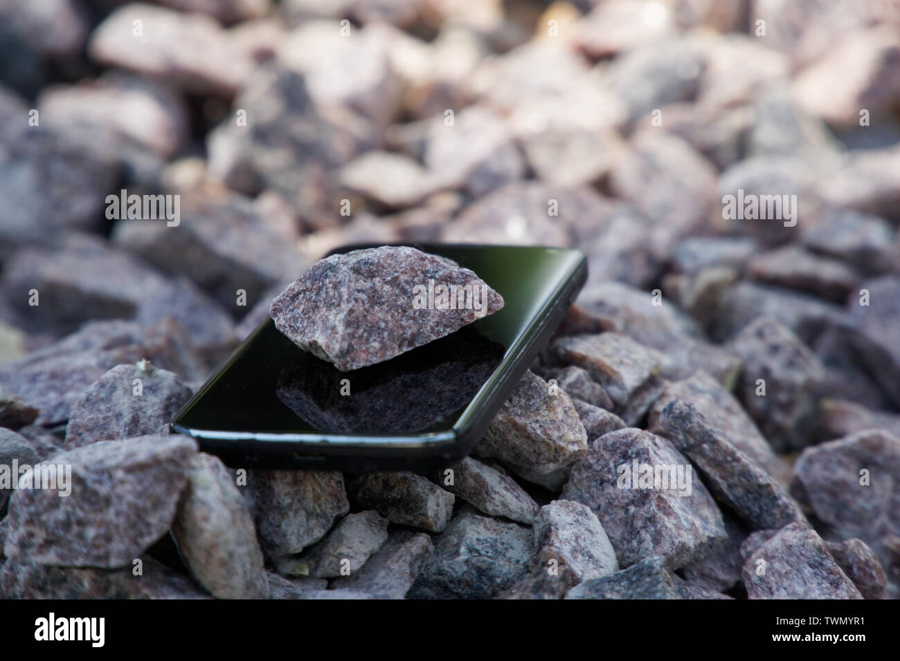 Cell phone with broken glass on gravel granite stones, unbreakable ...