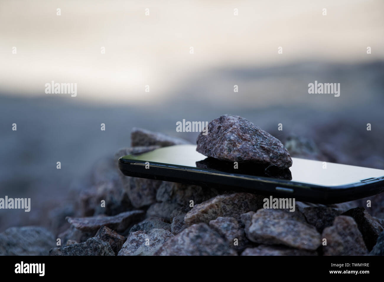 Cell phone with broken glass on gravel granite stones, unbreakable ...
