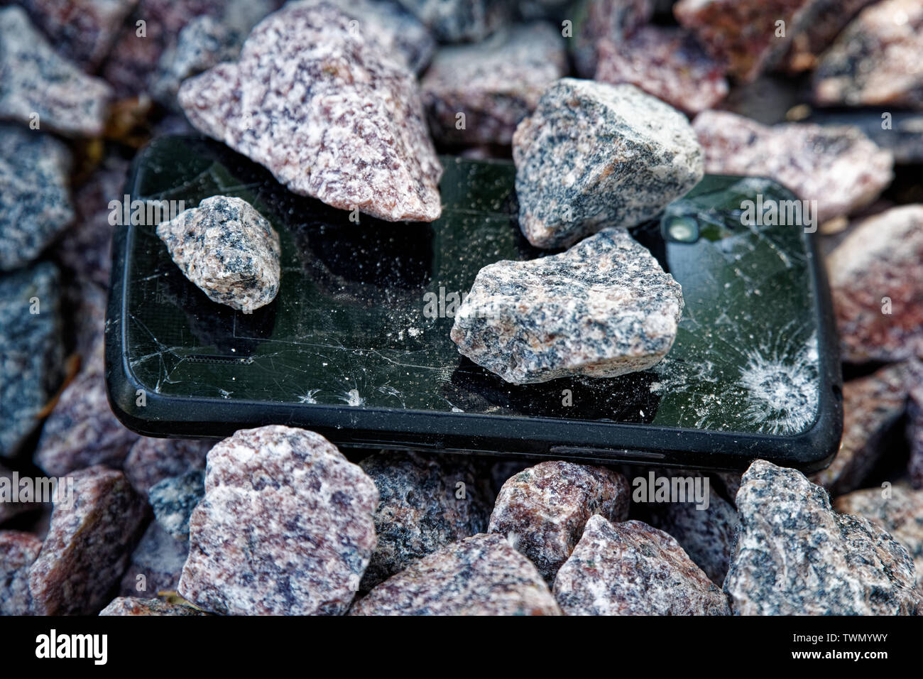 Cell phone with broken glass on gravel granite stones, unbreakable ...