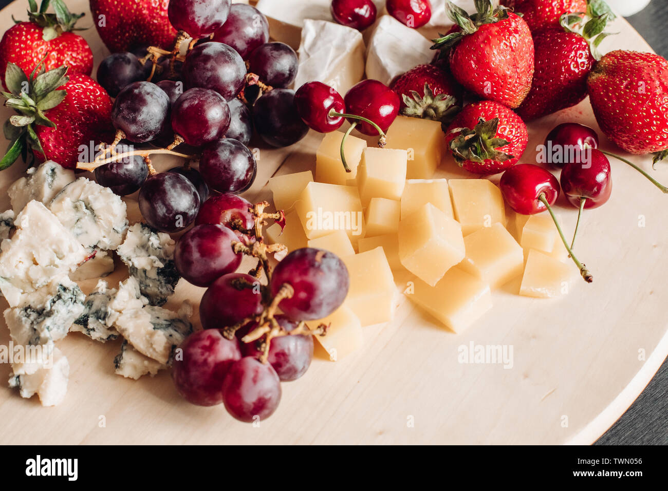 Assorted fruit and cheese plate.Close-up of delicious food plate Stock ...
