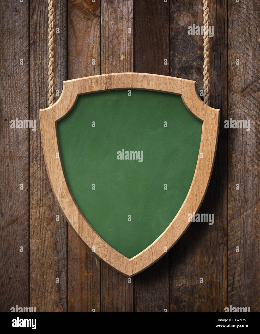 Defense protection shield shaped green blackboard hanging on ropes and ...