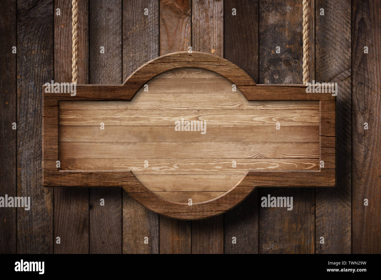 Wooden sign with rounded shape hanging on ropes with wood planks ...